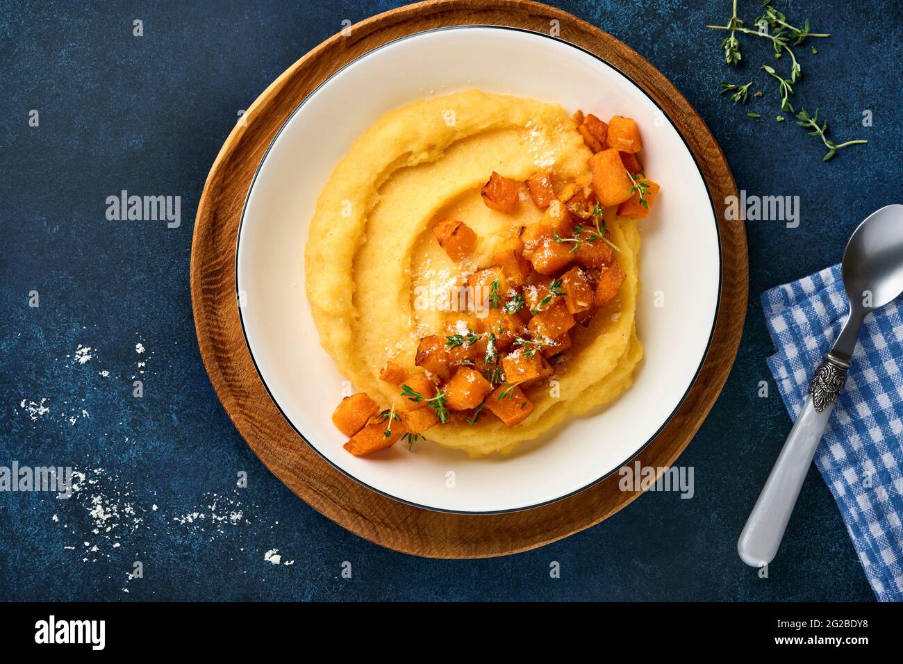 Polenta with butter, pumpkin, garlic, savory and parmesan cheese in ...