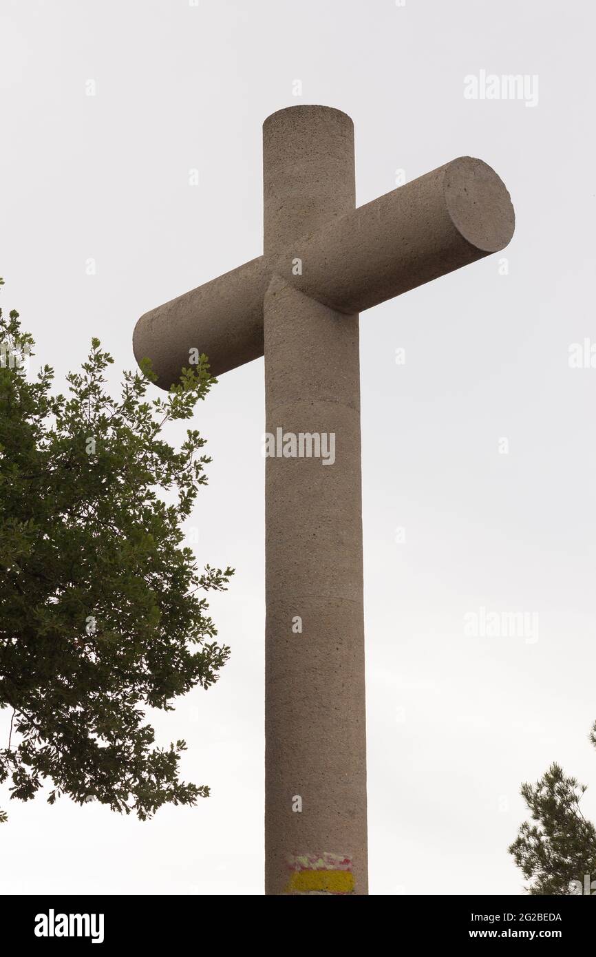 A stone cross on the top of a mountain, symbol of Christianity. Point ...