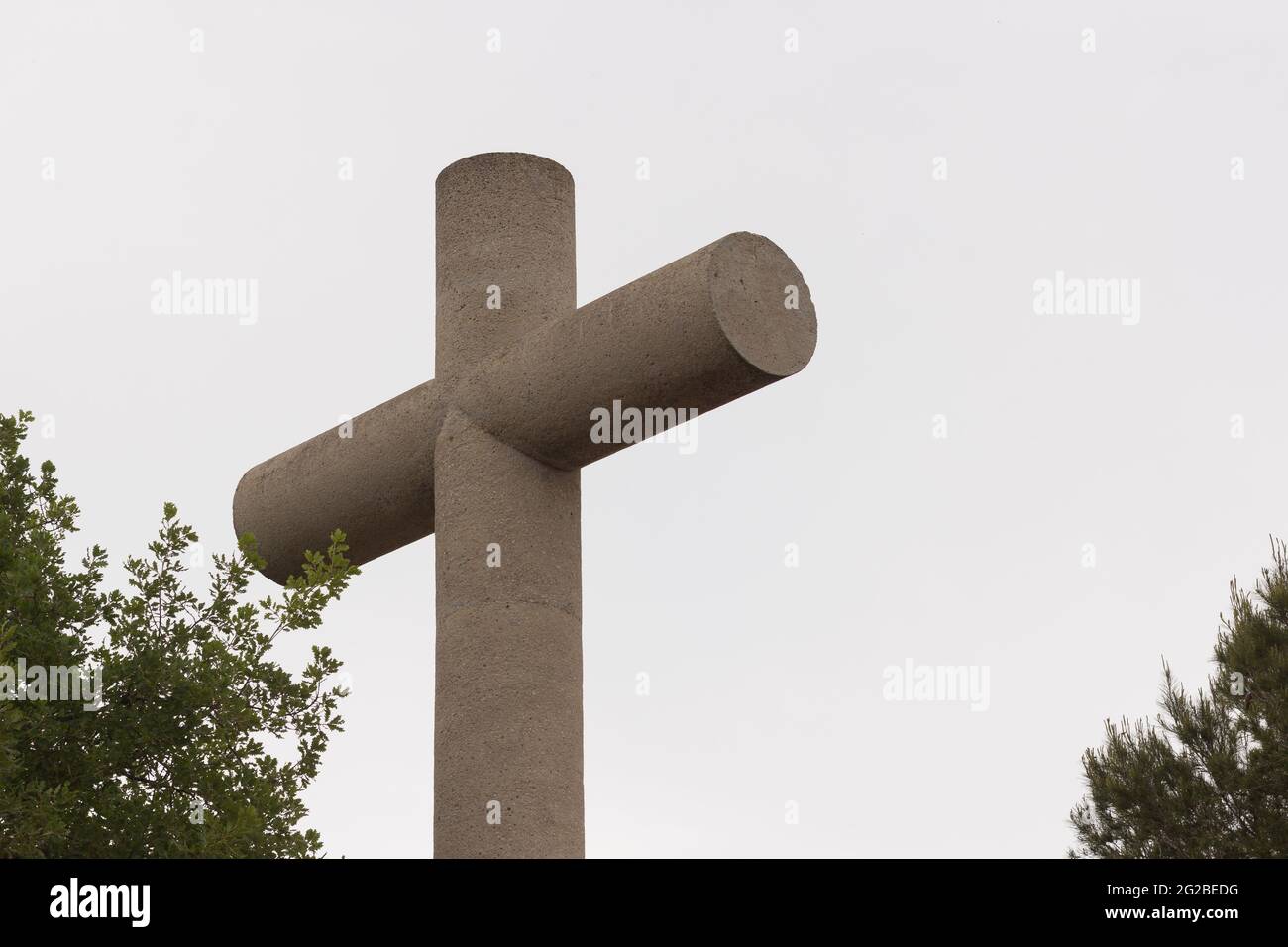 A stone cross on the top of a mountain, symbol of Christianity. Point ...