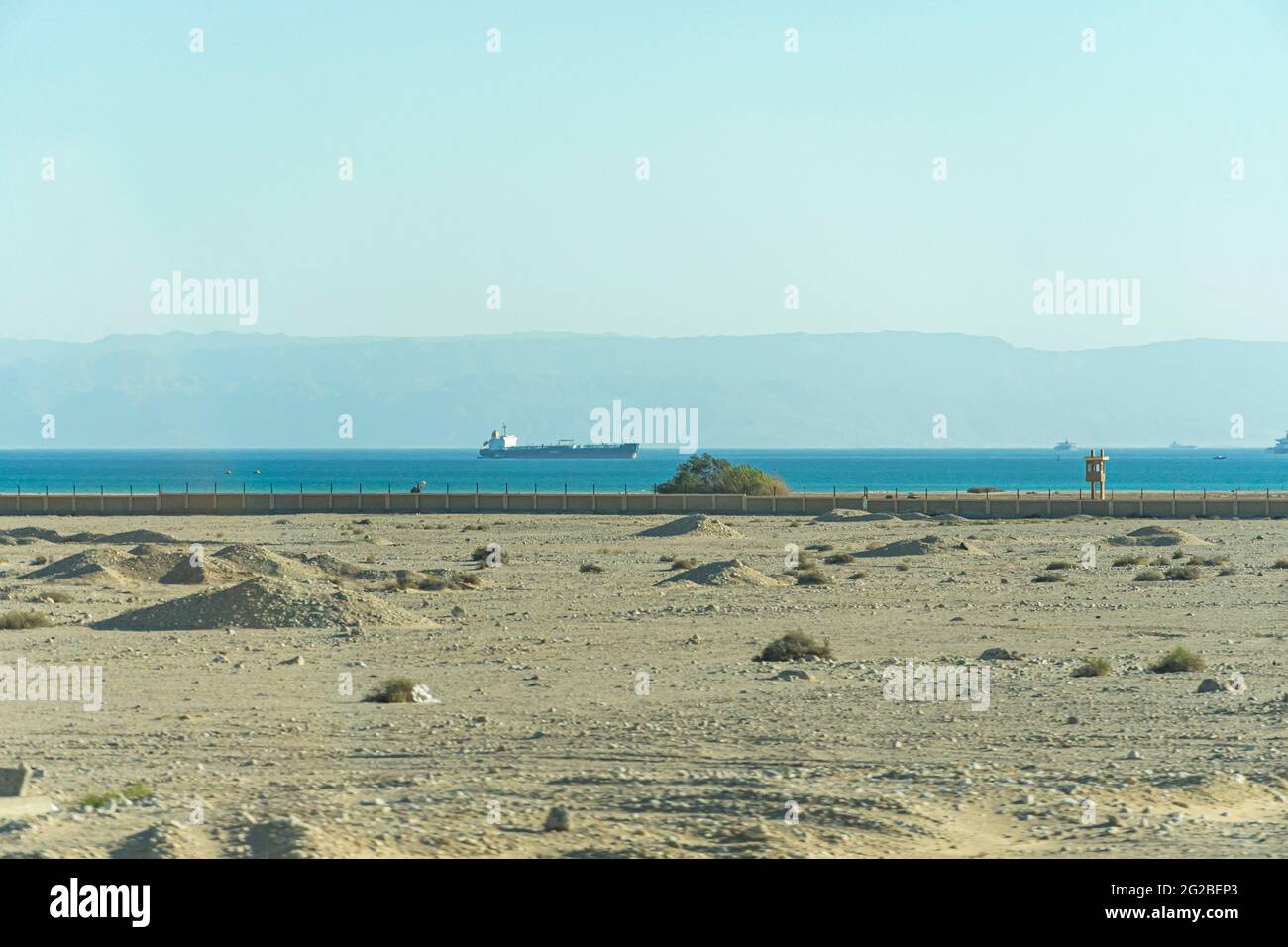 view of the eastern side of the Suez Canal with picturesque desert sand ...