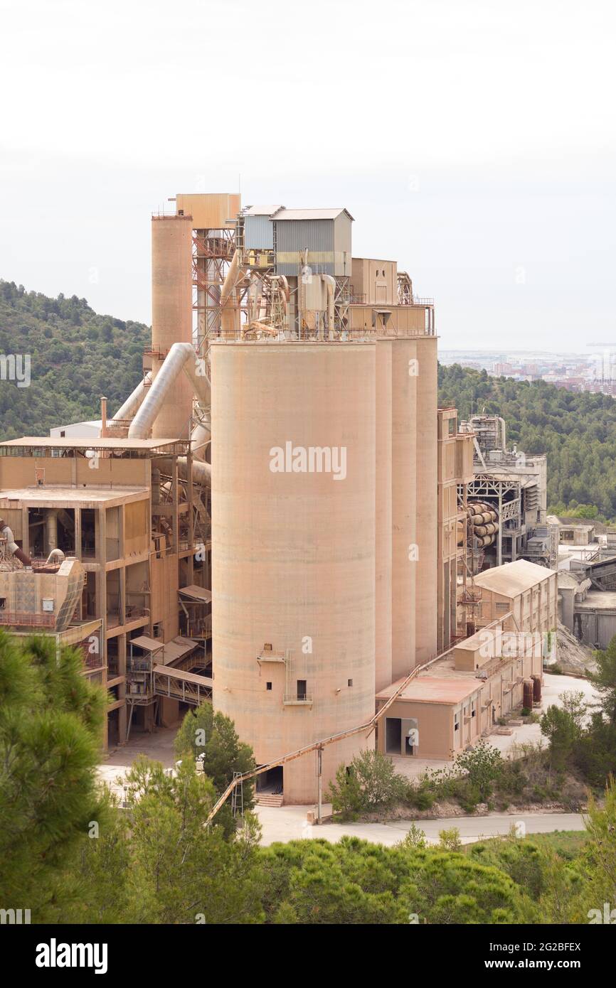Cement factory, closed a few years ago, with its silos and kilns ...