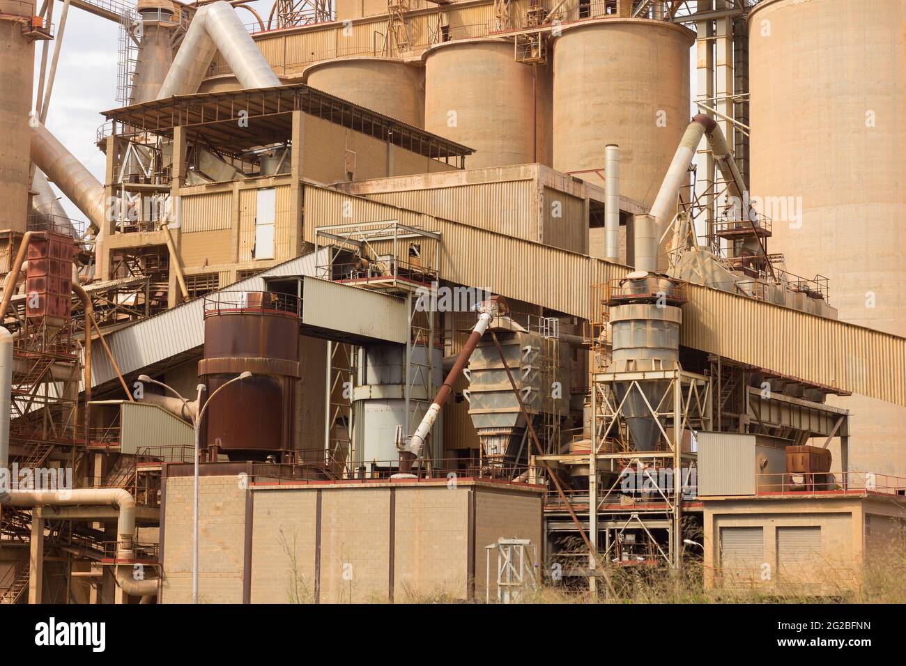 Cement factory, closed a few years ago, with its silos and kilns ...