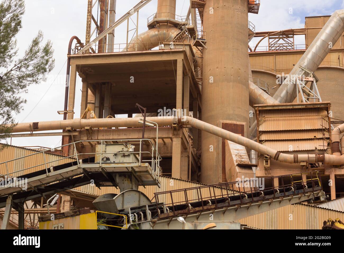 Cement factory, closed a few years ago, with its silos and kilns ...