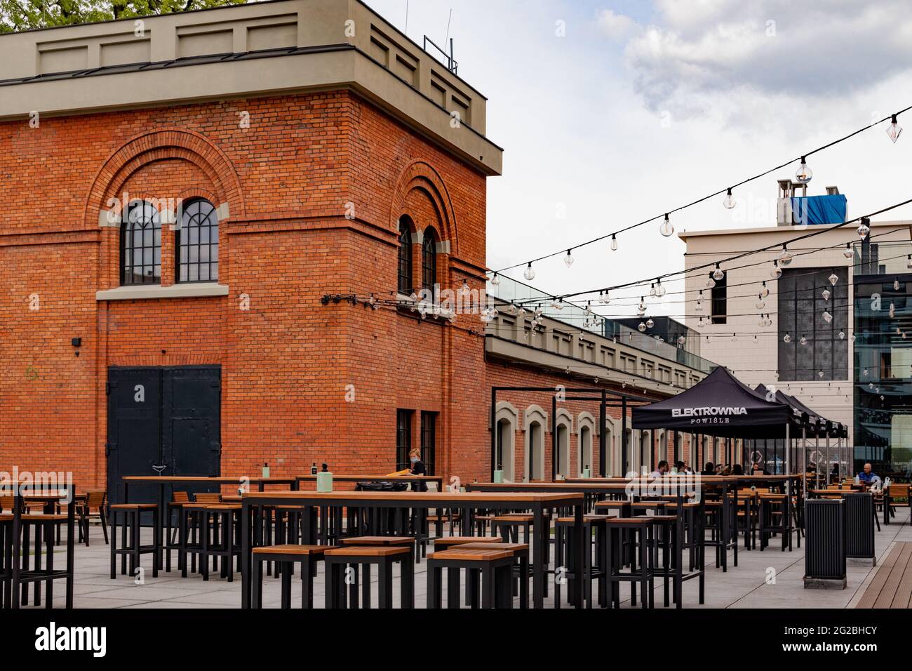 WARSAW, POLAND - May 25, 2021: Outdoor restaurant next to Elektrownia ...