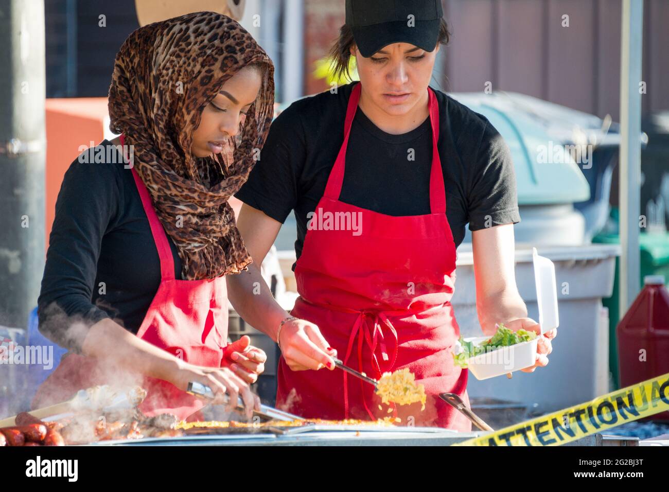 Scenes from Taste of Little Italy festival. Two young muslim women ...