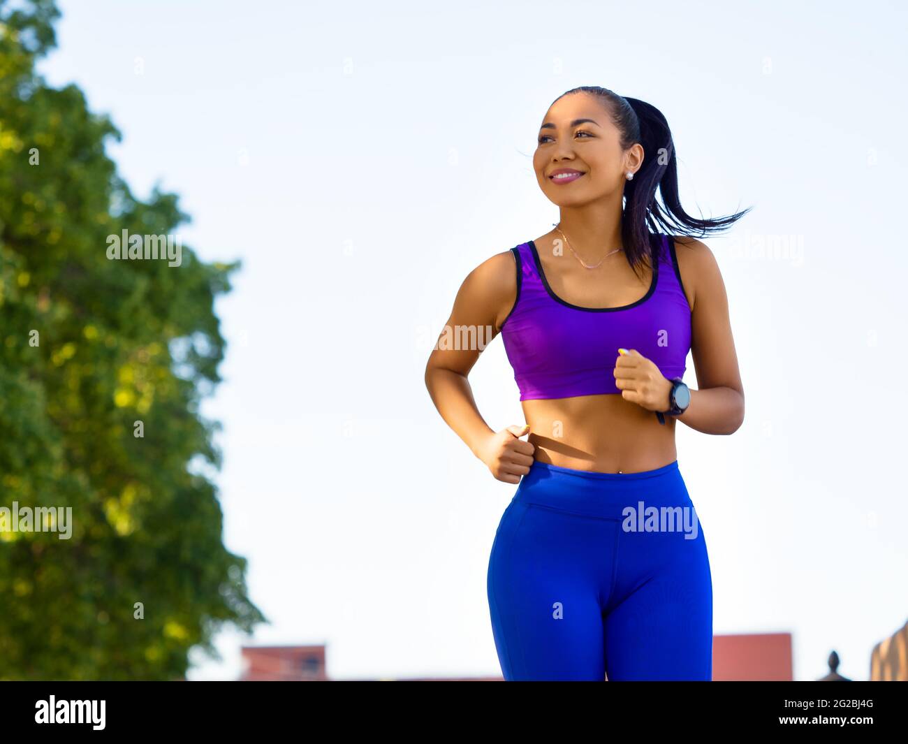 Asian woman running early in the morning. Attractive looking woman ...
