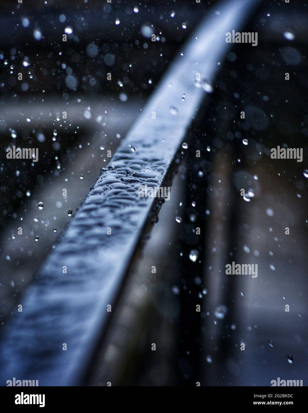 Closeup of wet metal railing Stock Photo - Alamy
