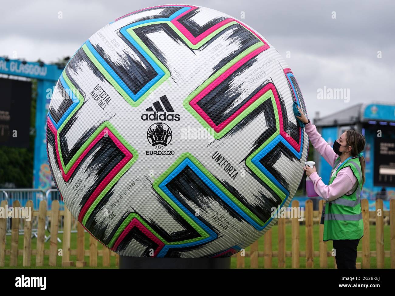 Aimee Harper cleans a giant ball as finishing preparations are made to ...