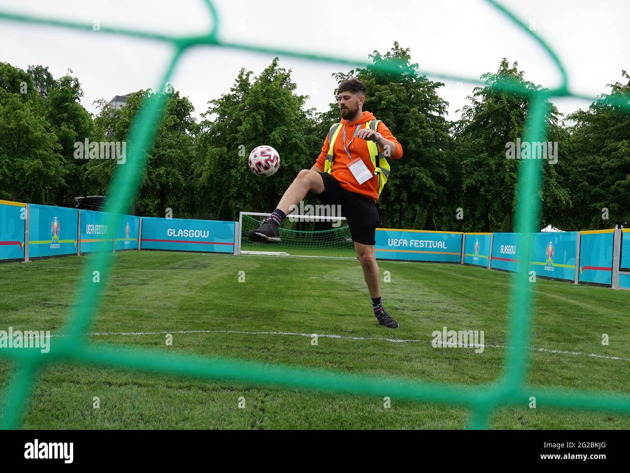 Workman Craig Malloy shows off his football skills at a five-a-side ...
