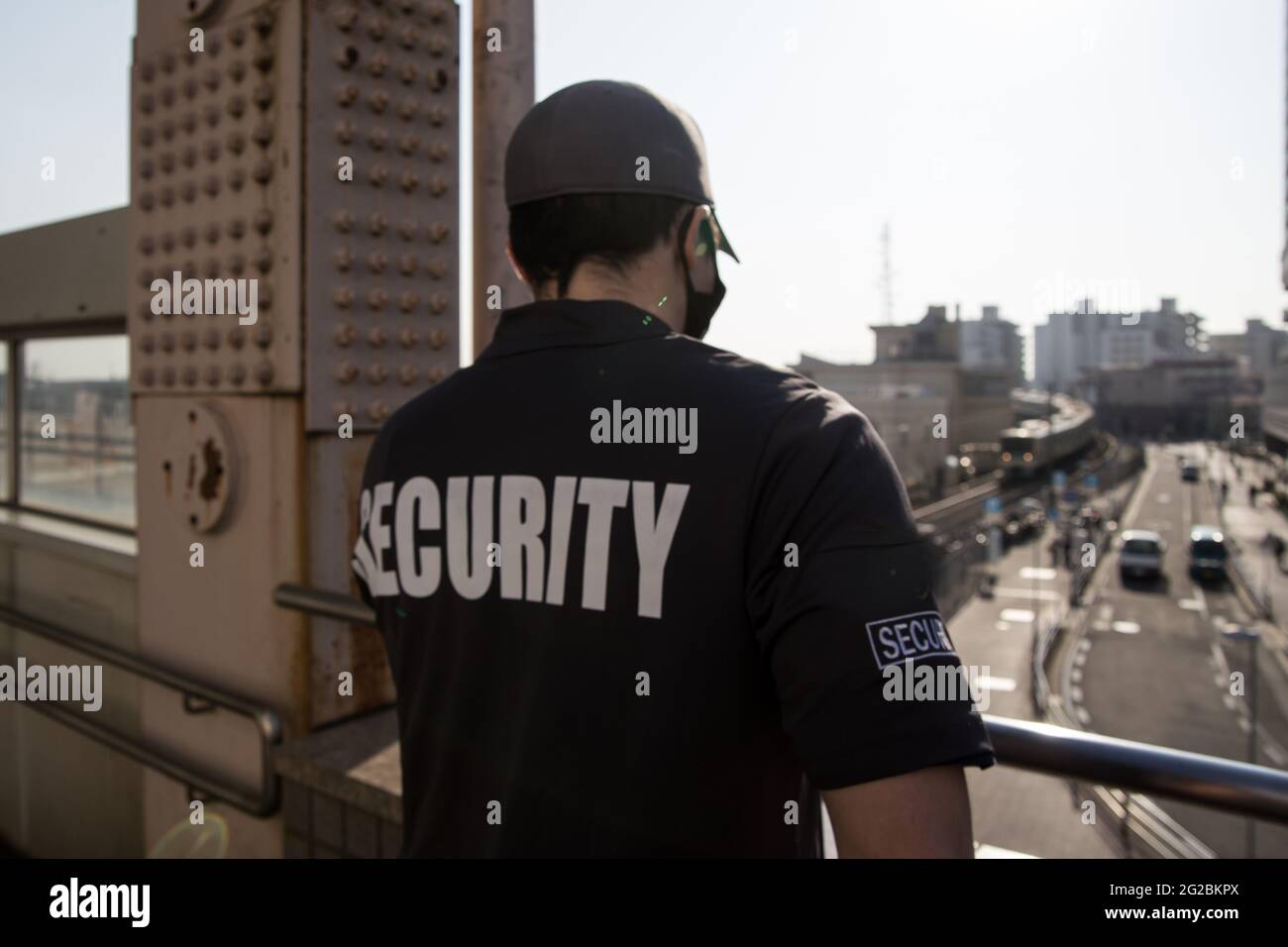 Closeup shot of a security guard in uniform patrolling a residential ...