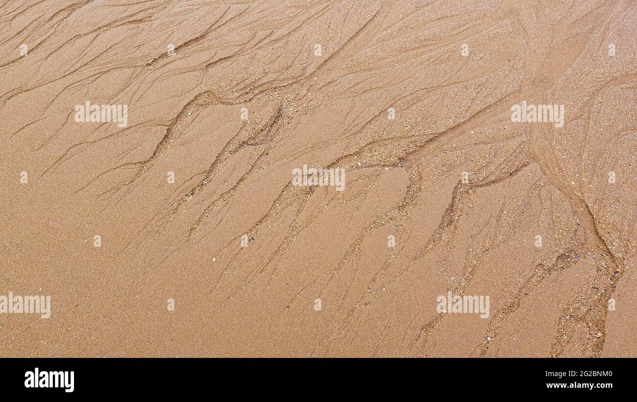 Patterns in sand, shaped by sea Stock Photo - Alamy