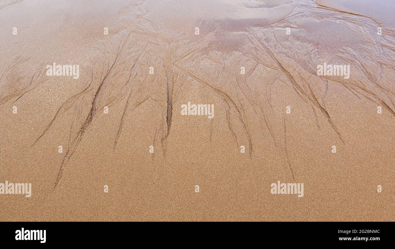 Patterns in sand, shaped by sea Stock Photo - Alamy