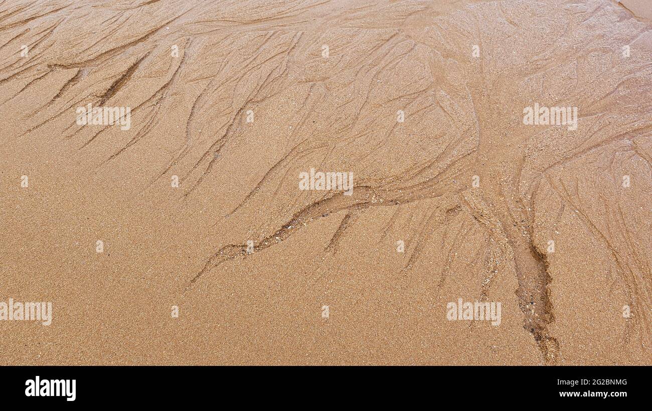 Patterns in sand, shaped by sea Stock Photo - Alamy