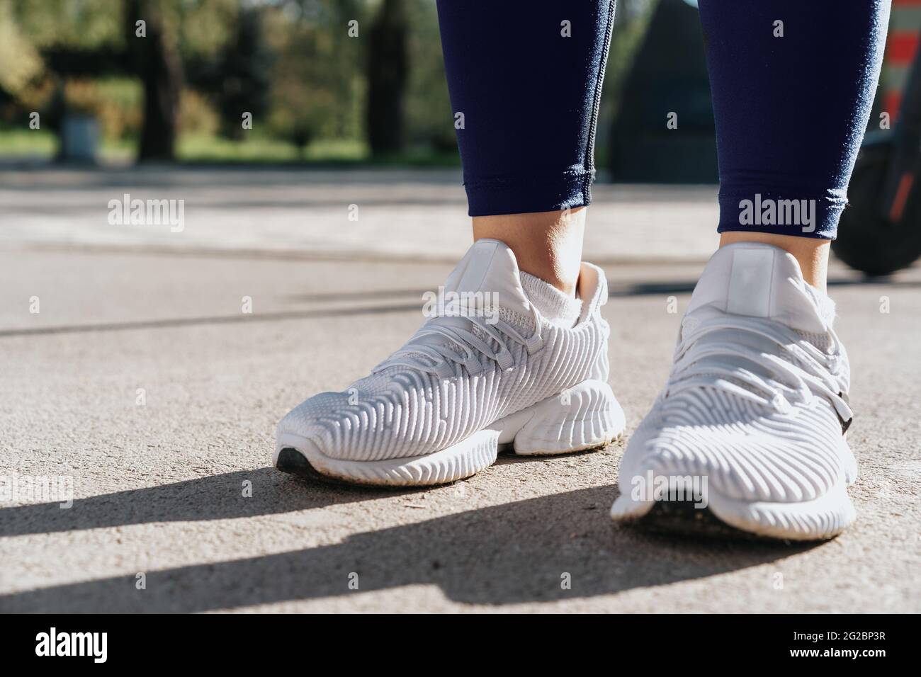 Feet of a woman dressed in sportswear and sneakers for running Stock ...