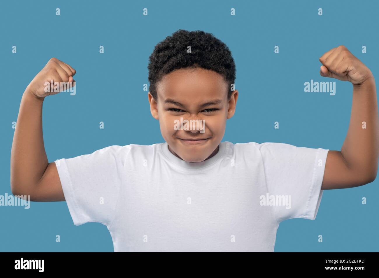 African American boy showing his strength Stock Photo - Alamy
