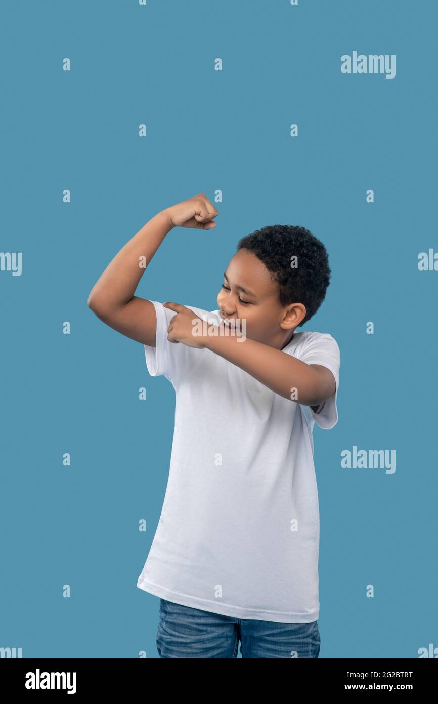 Strong muscles and child hi-res stock photography and images - Alamy