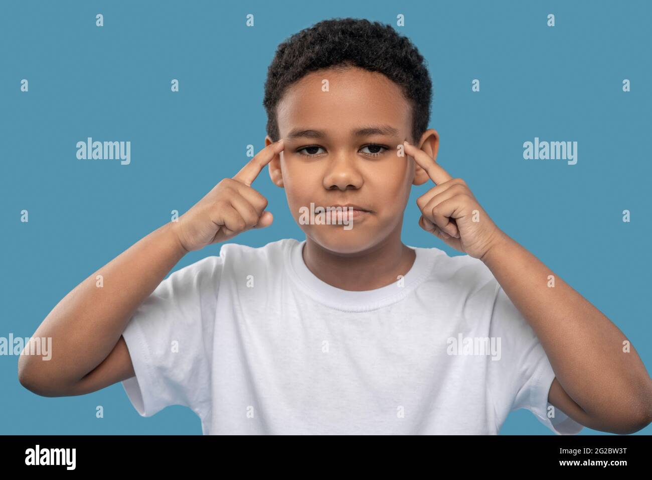 Child touch forehead hi-res stock photography and images - Alamy