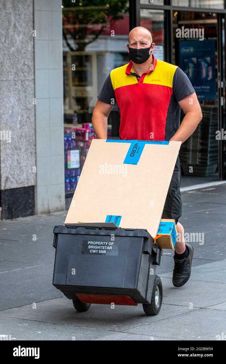 Delivery Man Pushing Trolley Parcels High Resolution Stock Photography ...