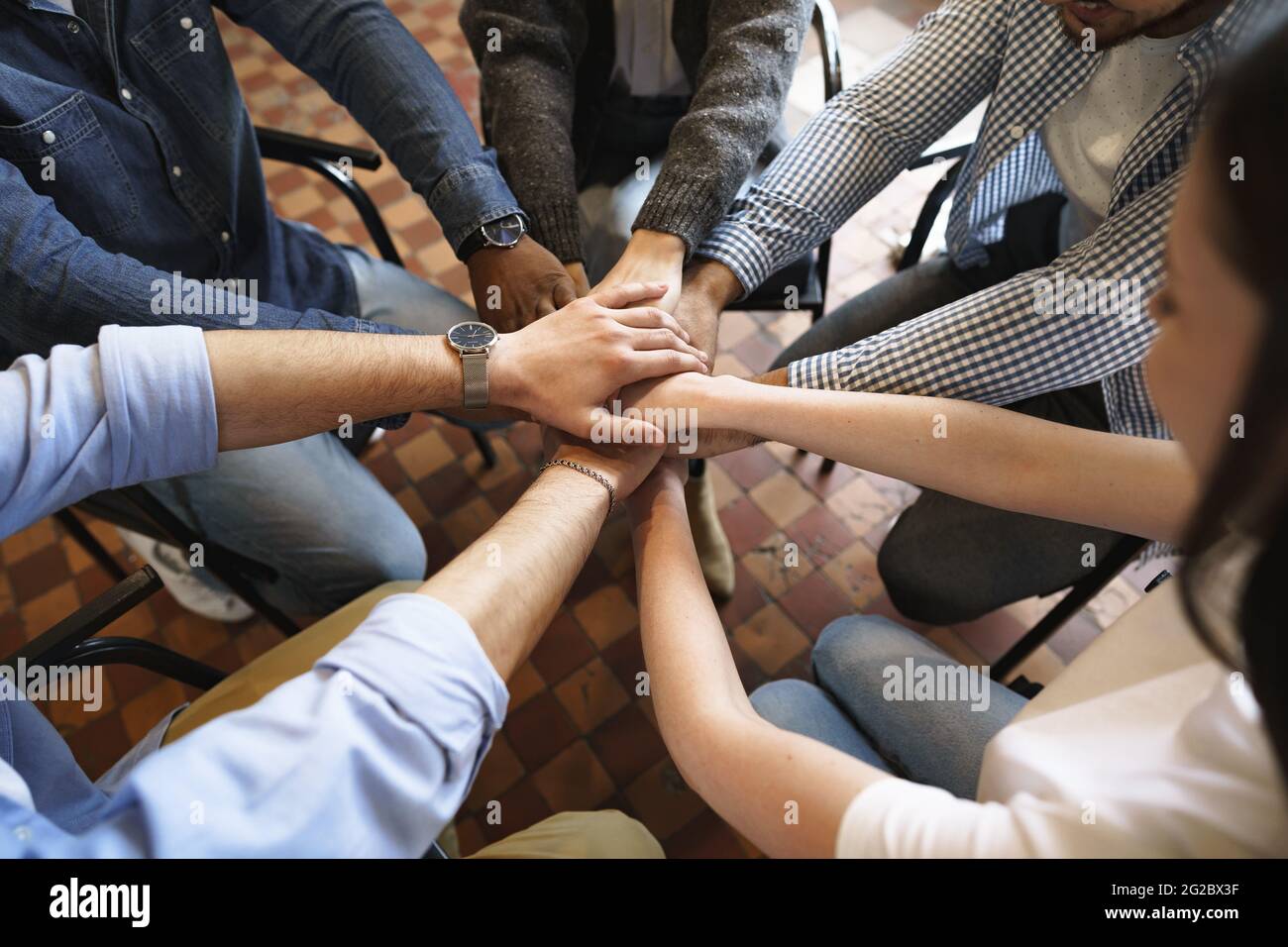 Top view of diverse people hands holding together in circle, hands ...