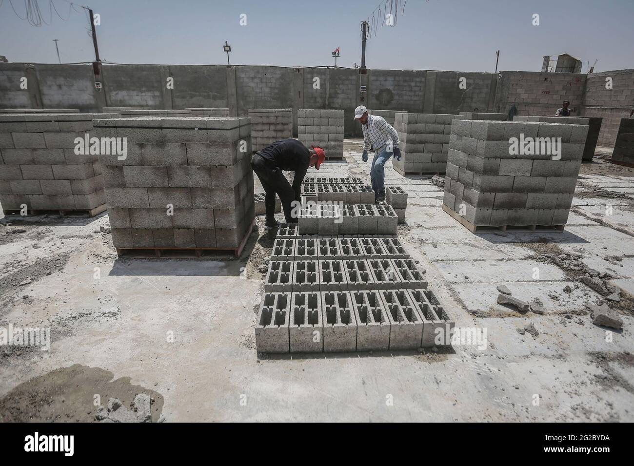 Gaza City, Palestinian Territories. 10th June, 2021. Workers line up ...