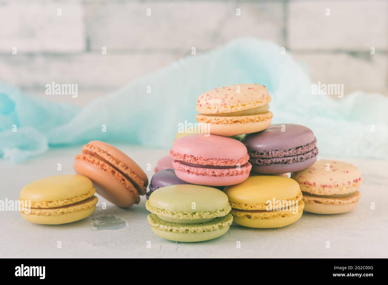 Stacked pastel colored french macarons in front of a white wall Stock ...