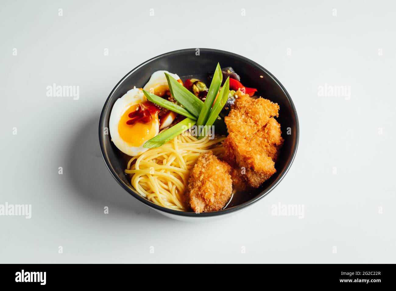 Closeup shot of spaghetti with fried chicken on the bowl Stock Photo ...