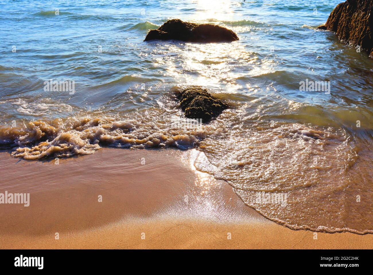 Heat at sea, waves glisten in the sun, beach vacation Stock Photo - Alamy