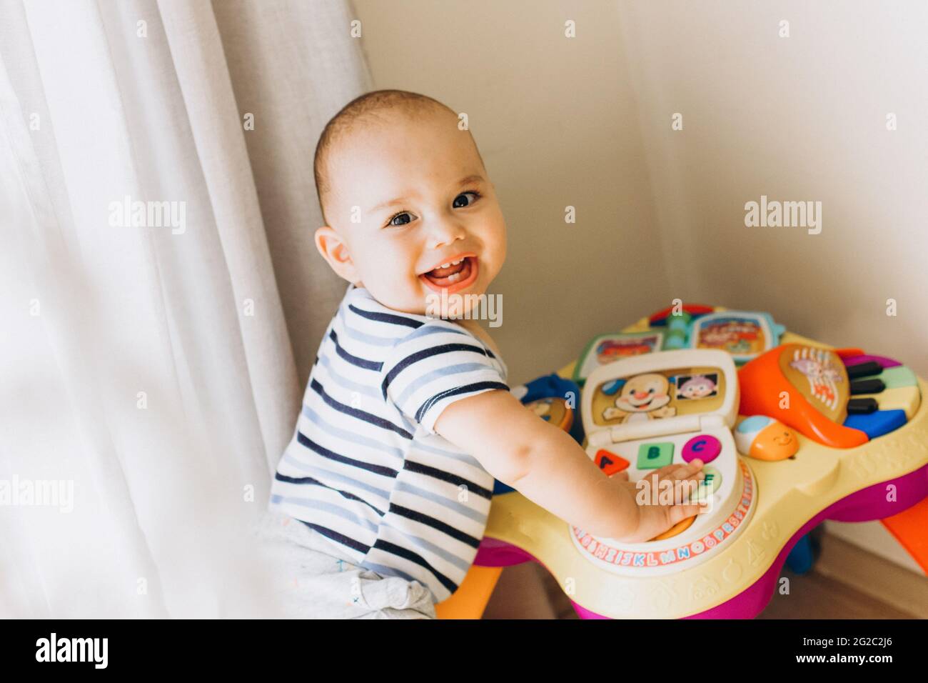 Happy smiling baby boy playing toys. Babyface close-up Stock Photo - Alamy
