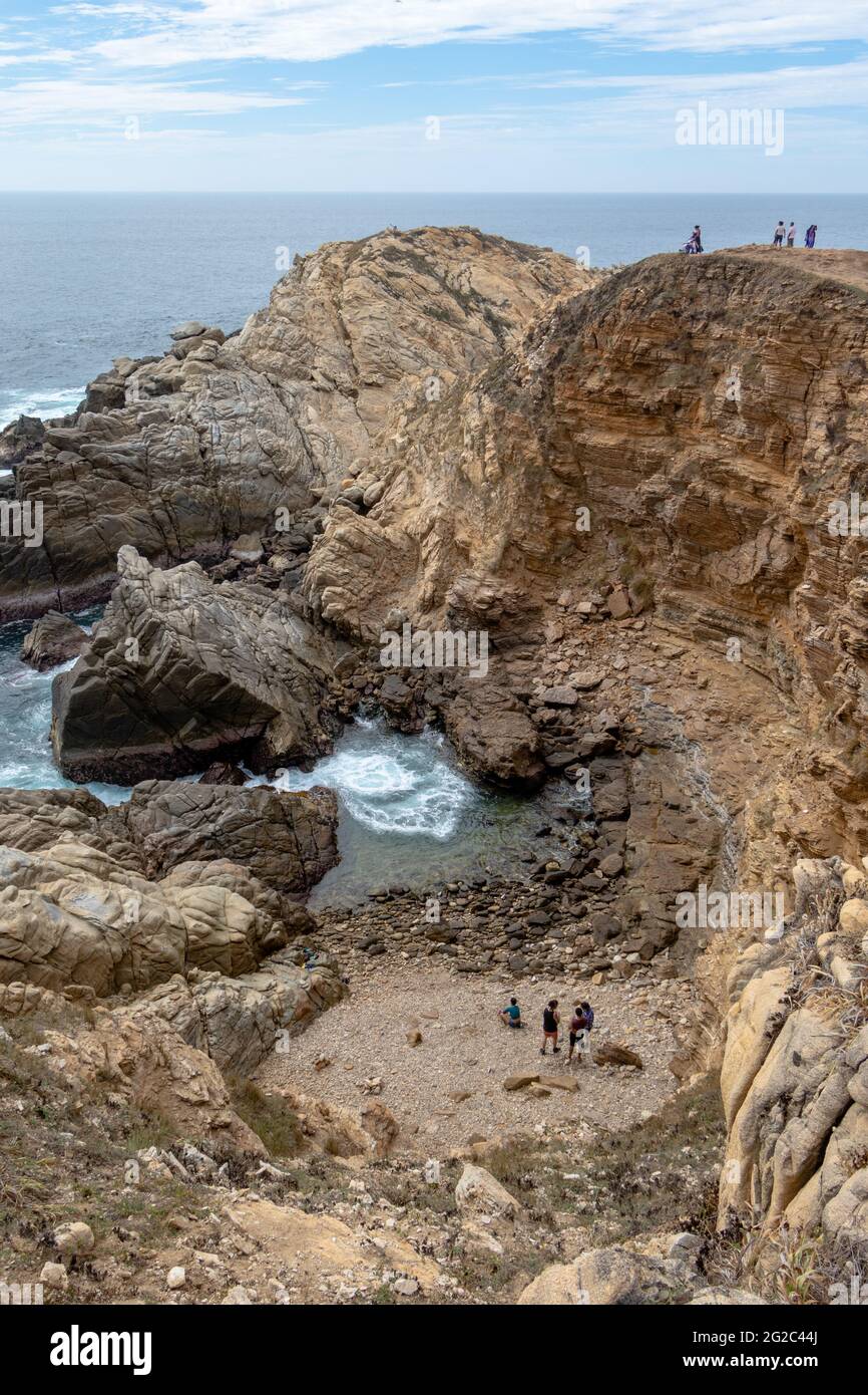 Beautiful seascape with a huge cliff and sea at daytime Stock Photo - Alamy