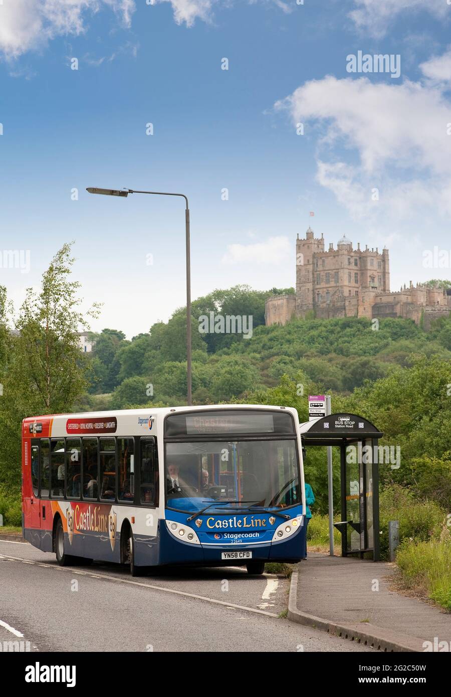 Bus at a bus stop in the market town of Bolsover with Bolsover Castle ...