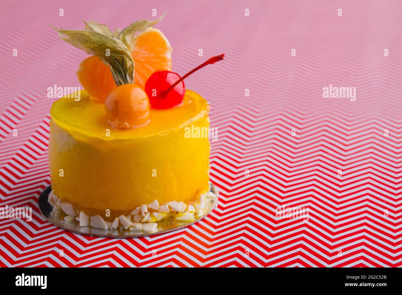 Beautiful yellow fruit cake with cherry and orange slice Stock Photo ...