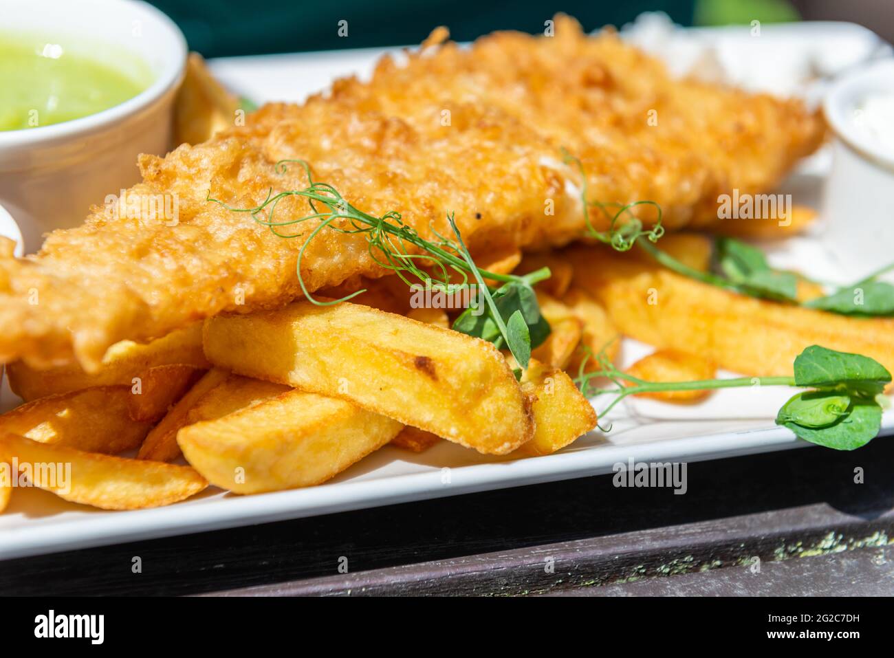 Fish and Chips with peas Stock Photo - Alamy