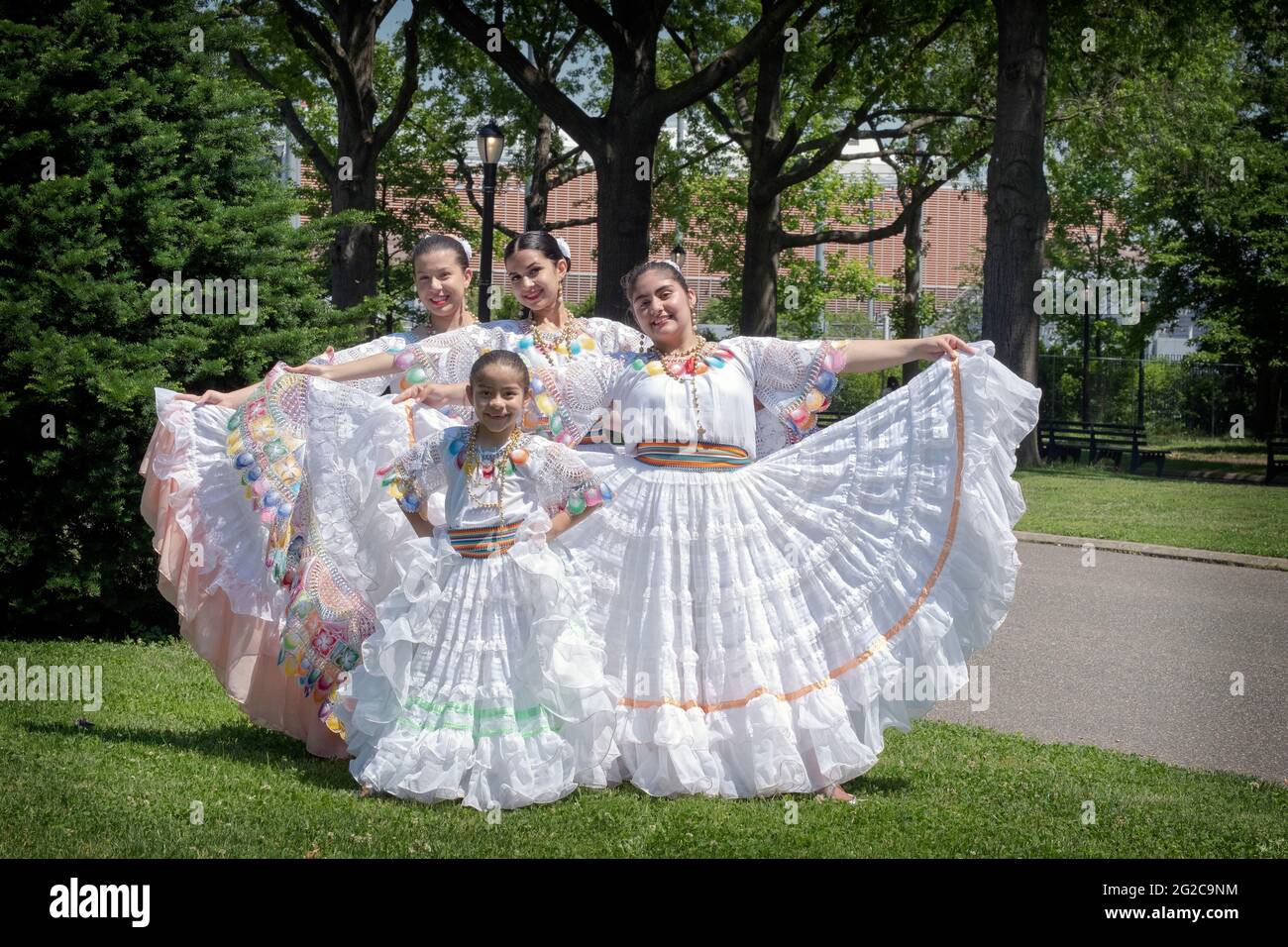 Posed photo of a group of Paraguayan American folk dancers in native ...