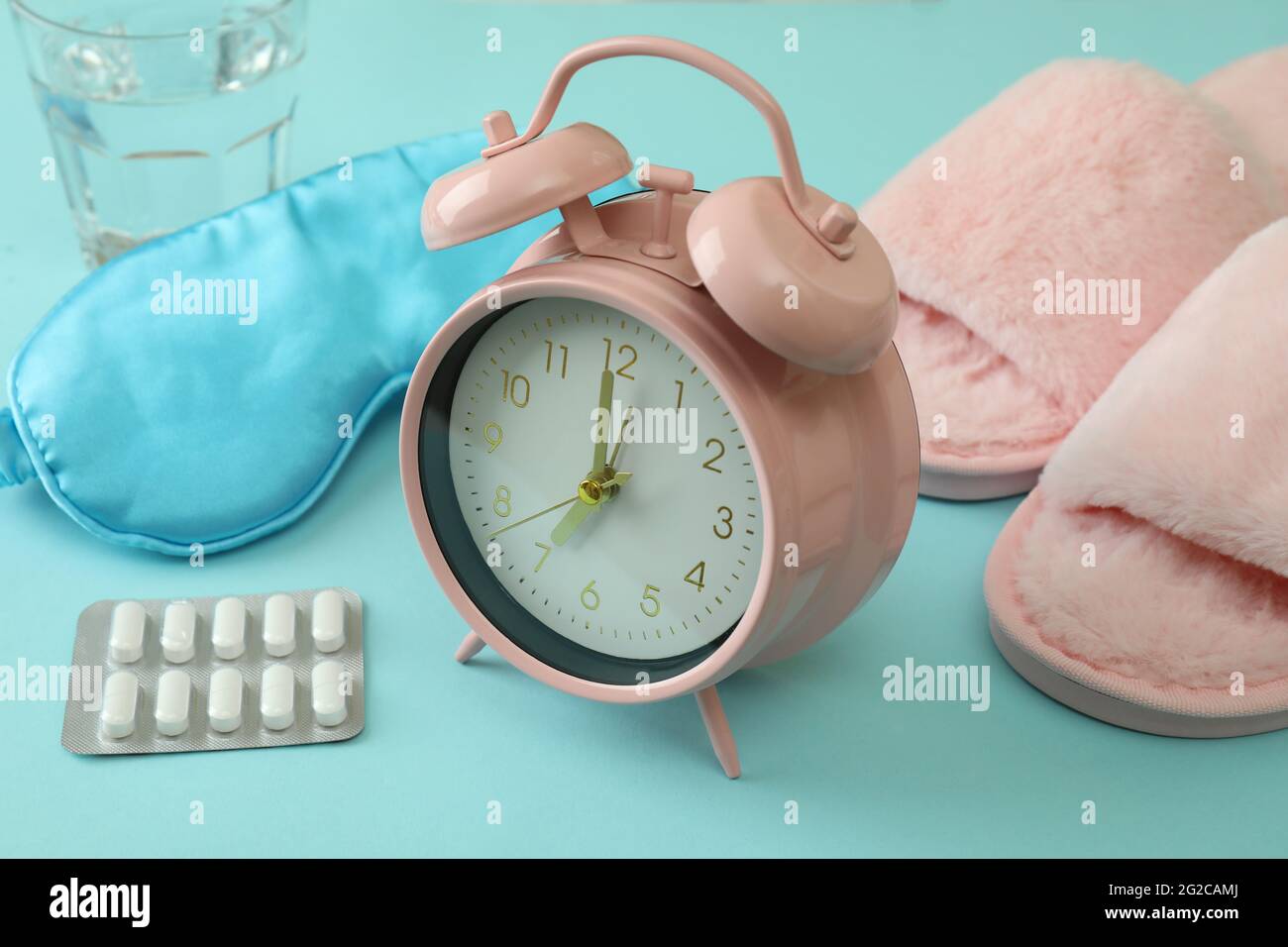 Female sleep routine accessories on blue background Stock Photo - Alamy