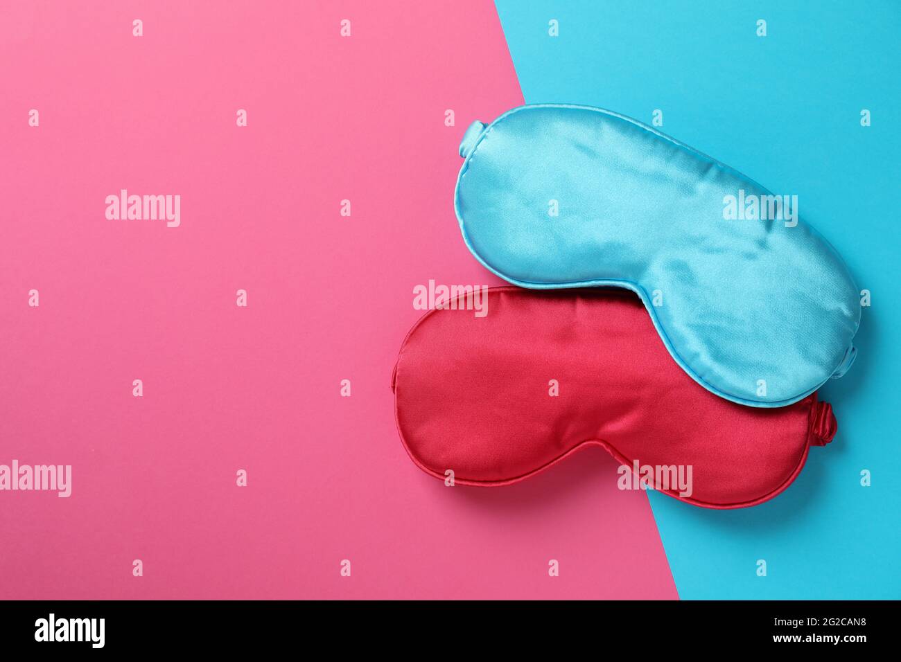 Two sleep masks on two tone background Stock Photo - Alamy