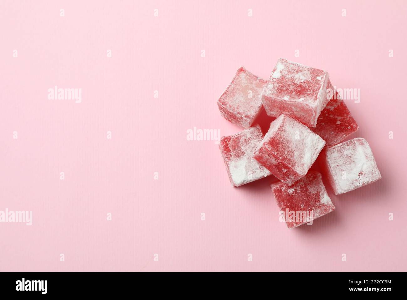 Delicious turkish delight cubes on pink background Stock Photo - Alamy