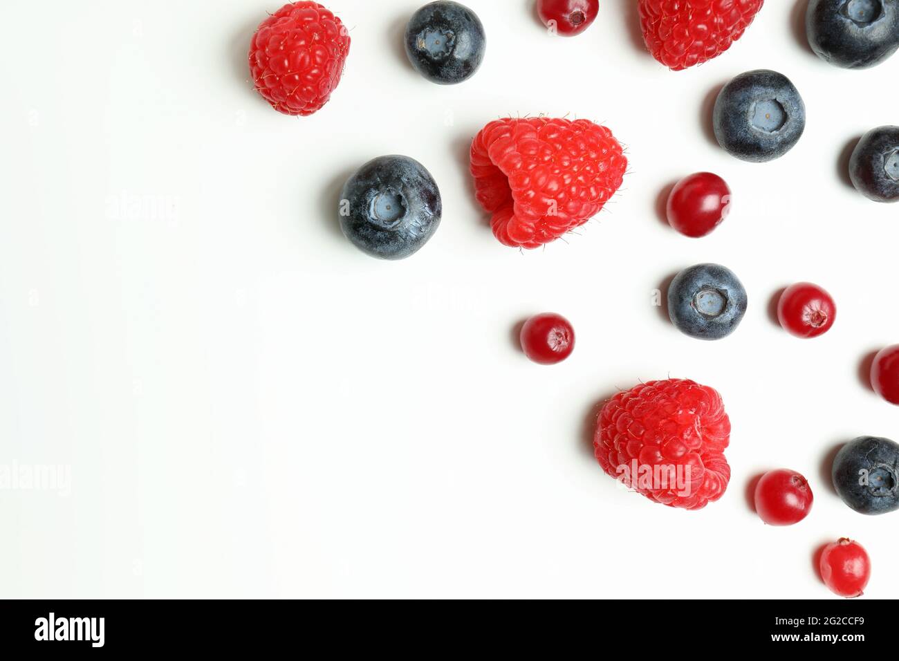 Delicious fresh berry mix on white background Stock Photo - Alamy