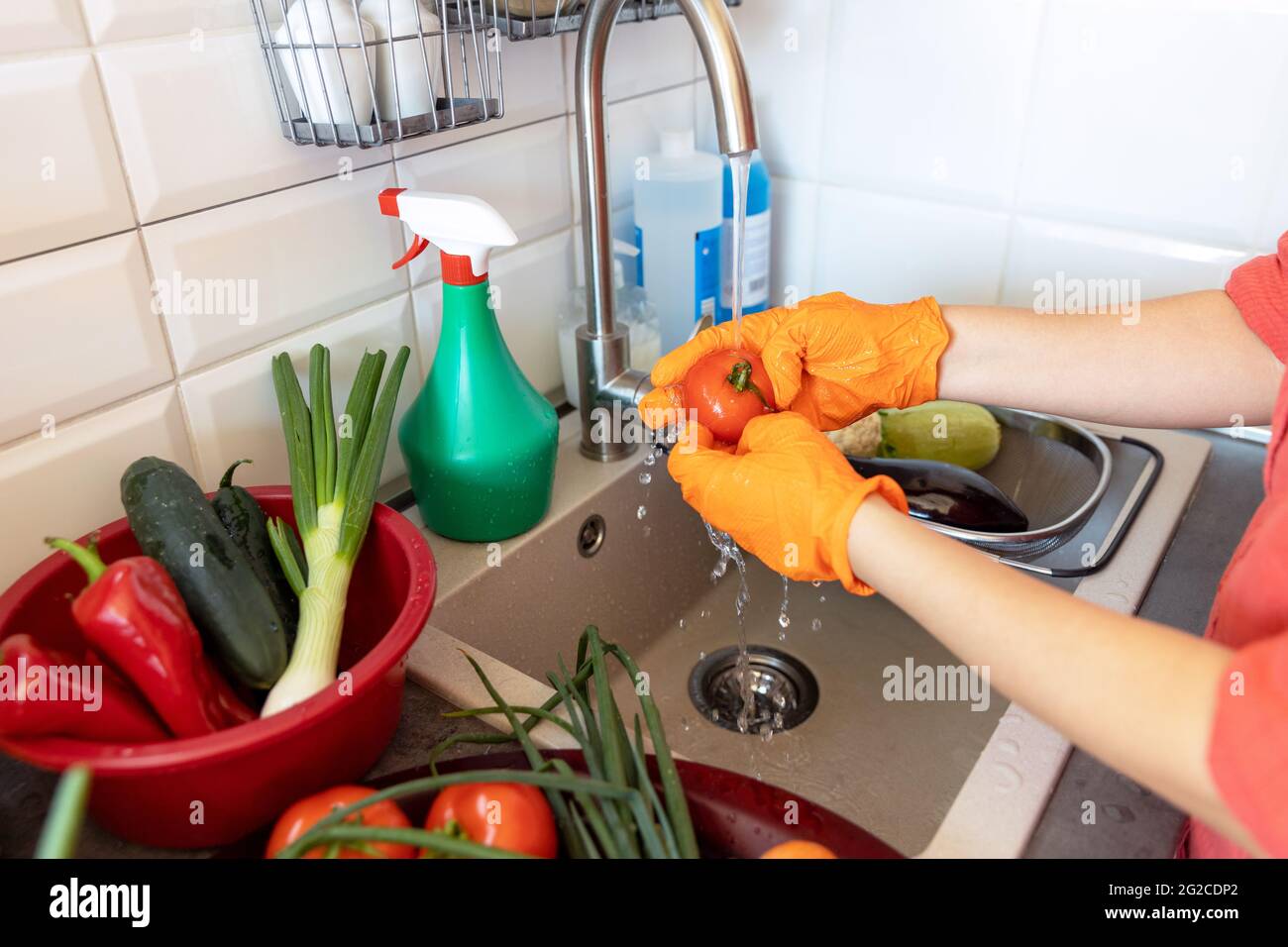 Fresh vegetables washing with water flowing in kitchen sink Stock Photo ...