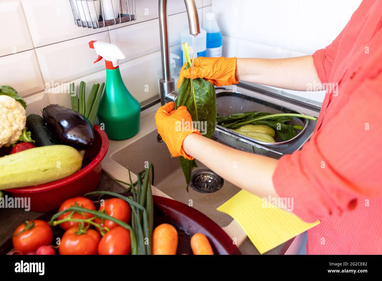 Fresh vegetables washing with water flowing in kitchen sink Stock Photo ...