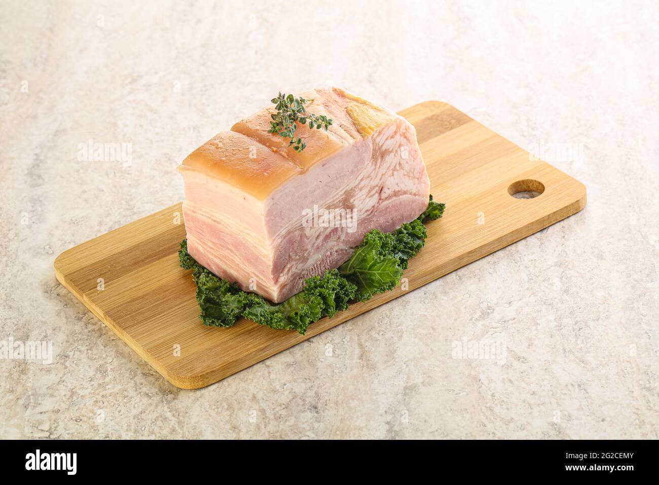 Cut of homemade pork bacon over board Stock Photo - Alamy