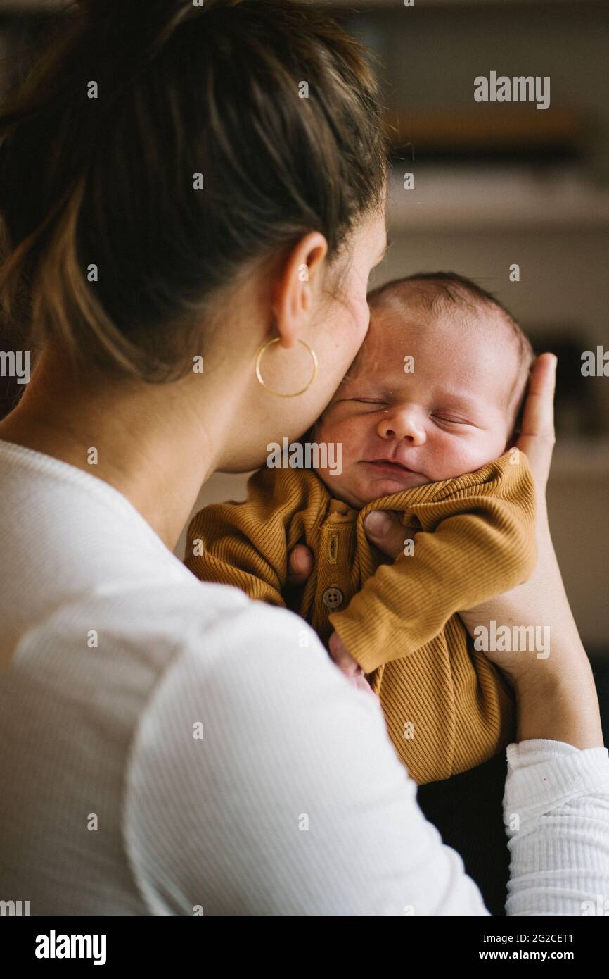 Mother holding newborn baby Stock Photo - Alamy