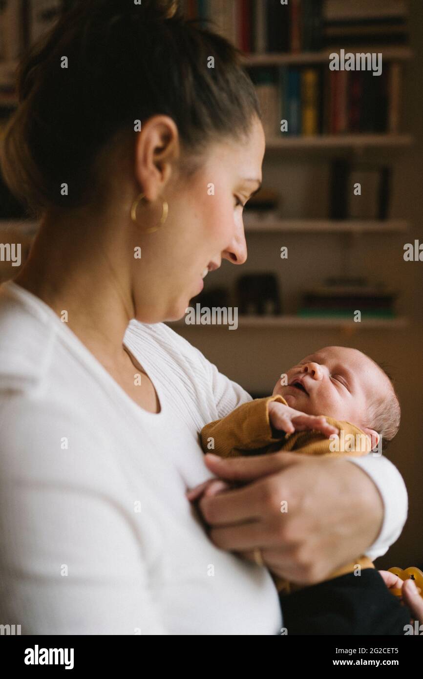 Mother holding newborn baby Stock Photo - Alamy