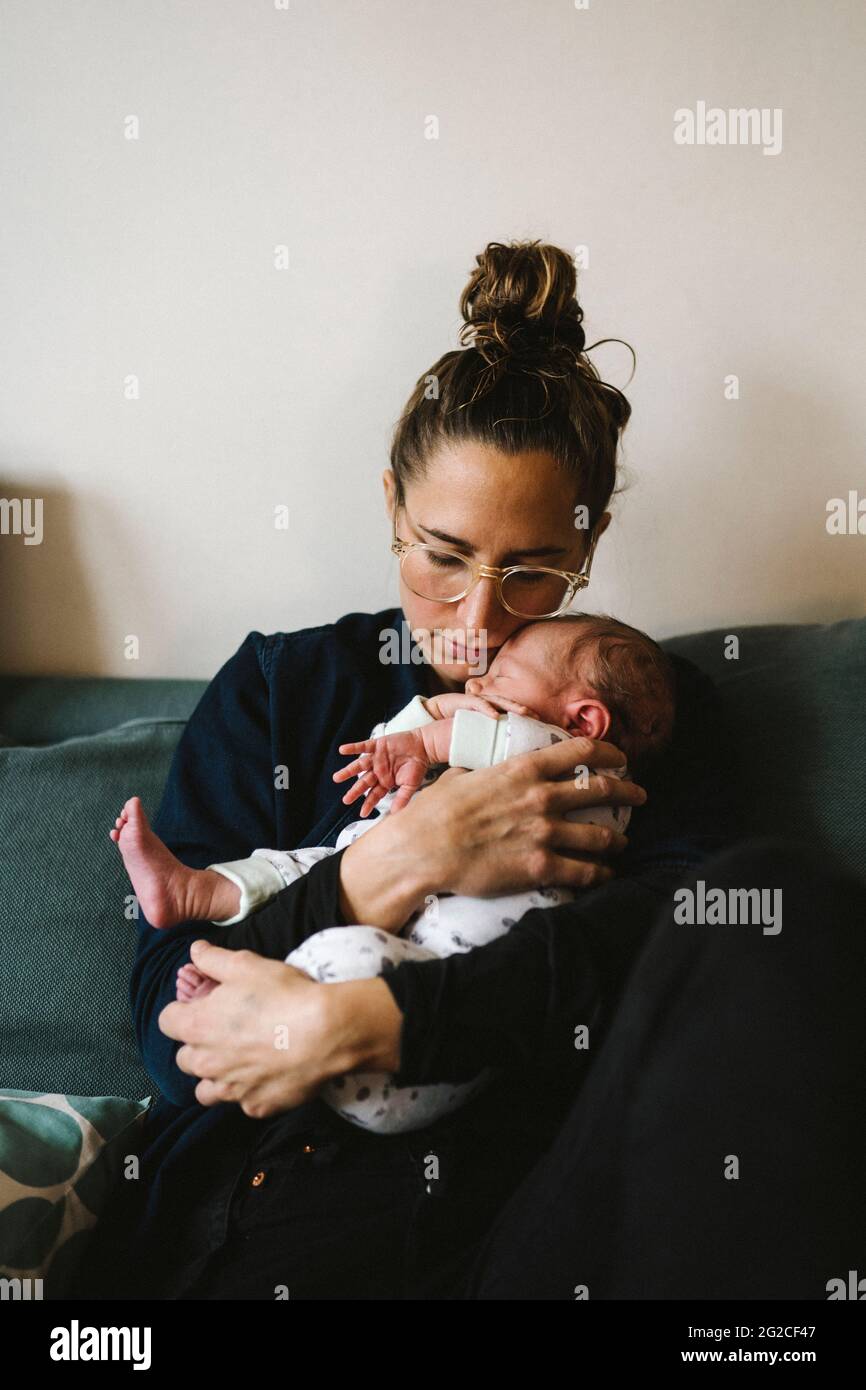 Mother holding newborn baby Stock Photo - Alamy