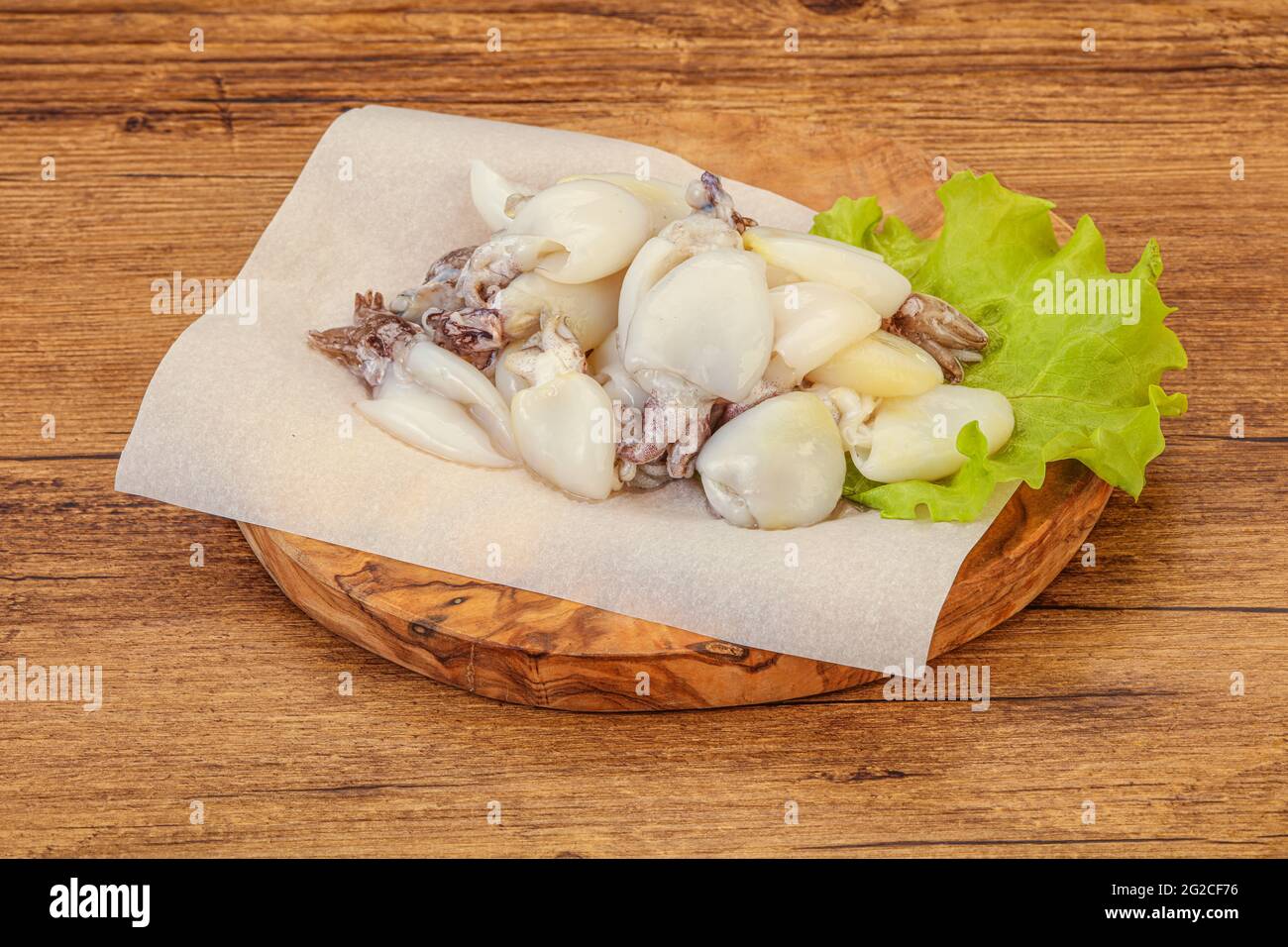 Raw seafood - cuttlefish for cooking over board Stock Photo - Alamy