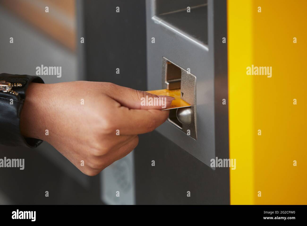 Hand using ticket machine Stock Photo - Alamy