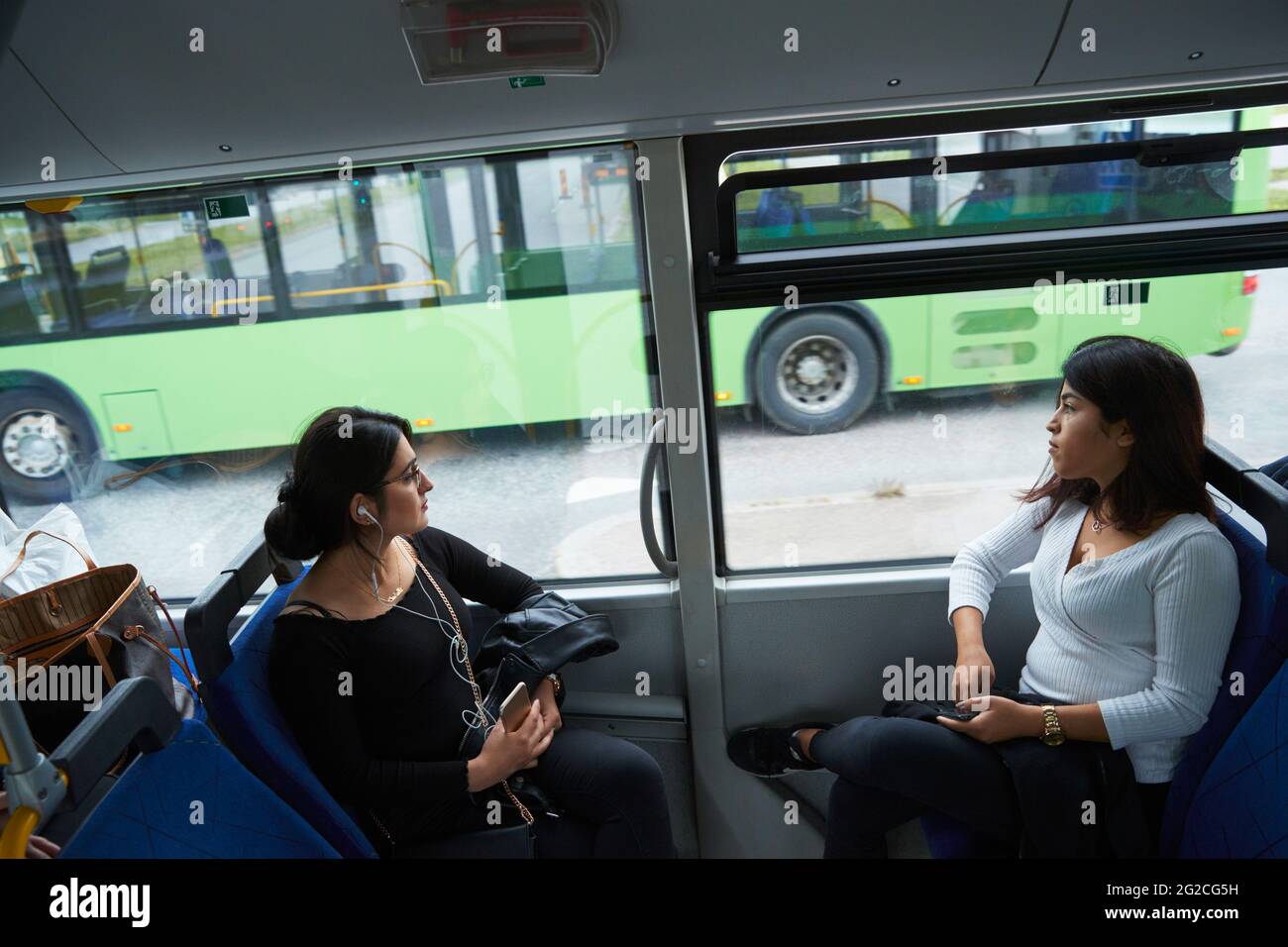 Women sitting in bus Stock Photo - Alamy