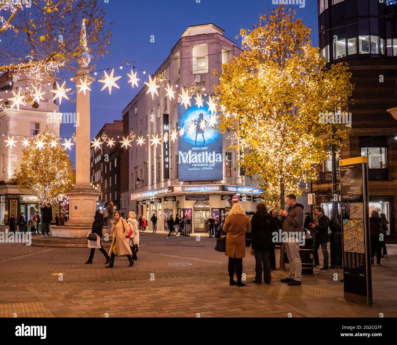 Seven Dials, London. The bright Christmas lights at the central ...