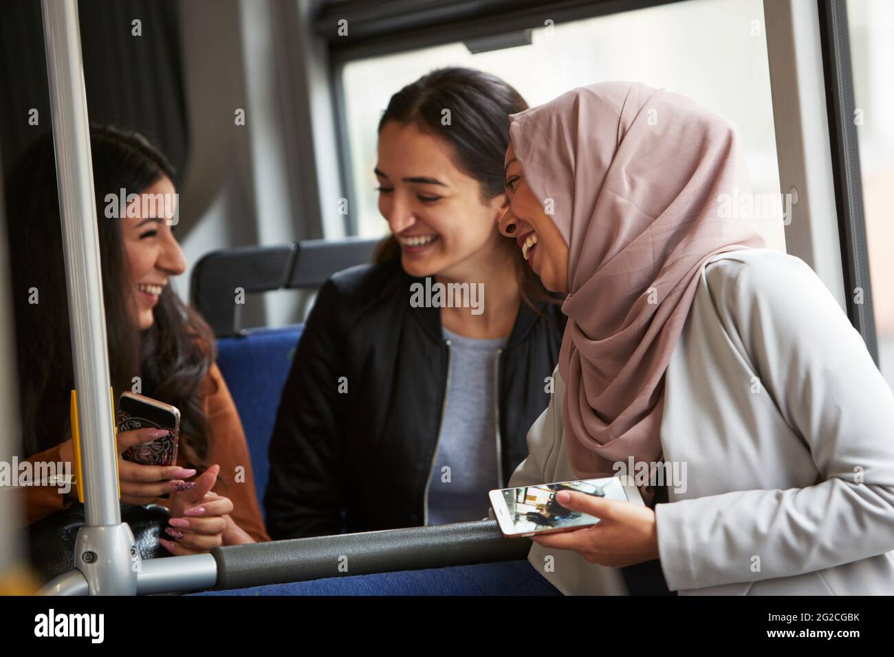 Female friends in bus Stock Photo - Alamy