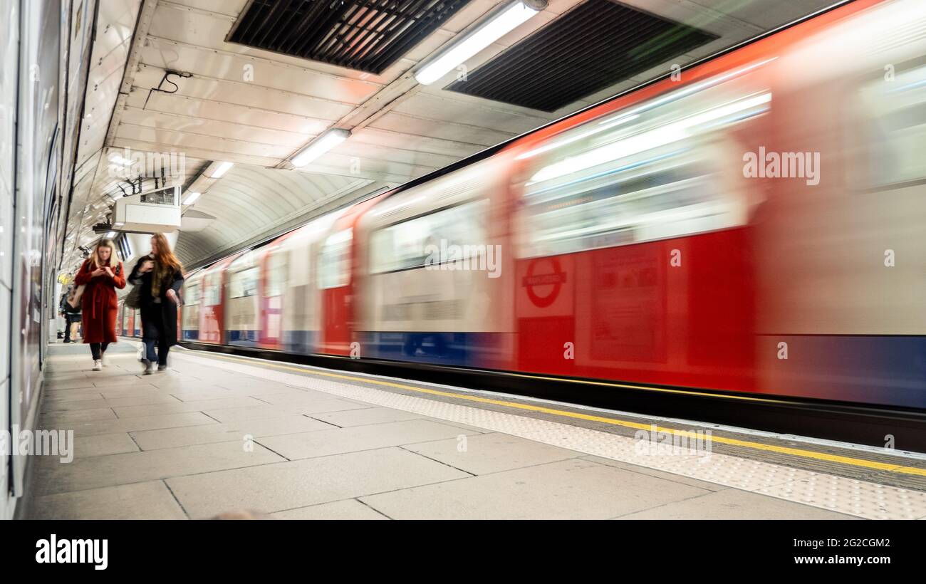 London Underground. Long exposure abstract blur of a tube train leaving ...