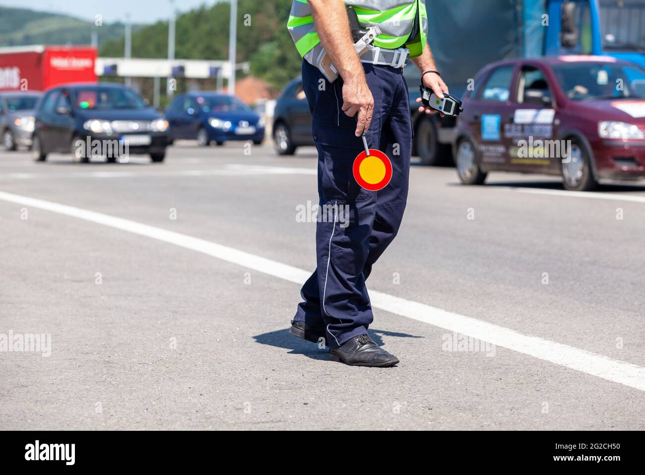 Policeman controlling traffic on the highway Stock Photo - Alamy